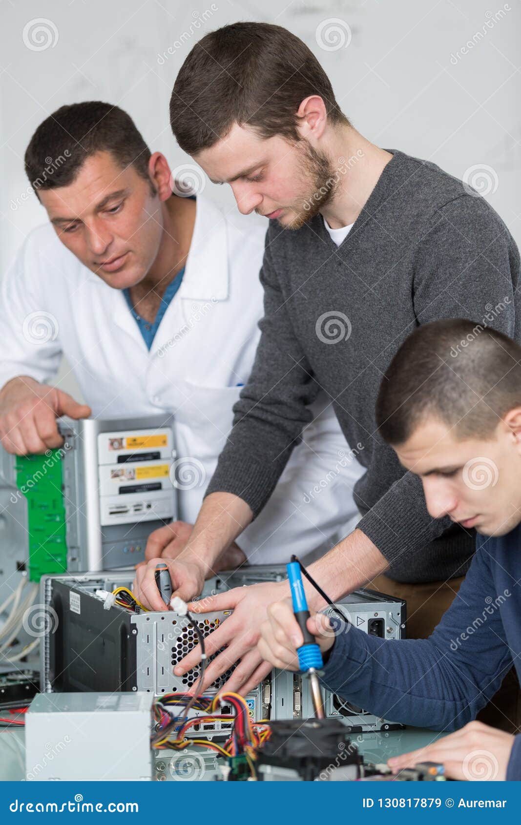 Tutor and Student Fixing Computer in Class Stock Image - Image of adult ...