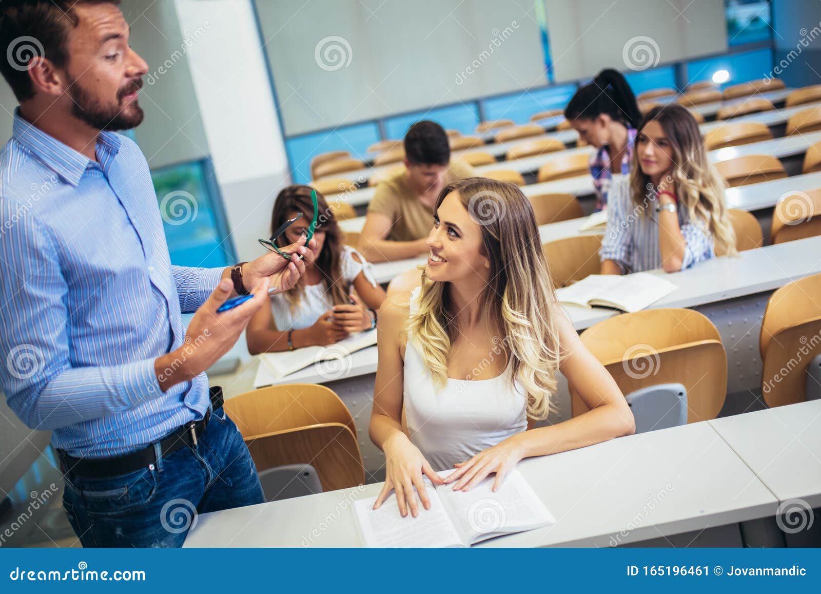 Tutor Teaching University Students in Classroom Stock Image - Image of ...