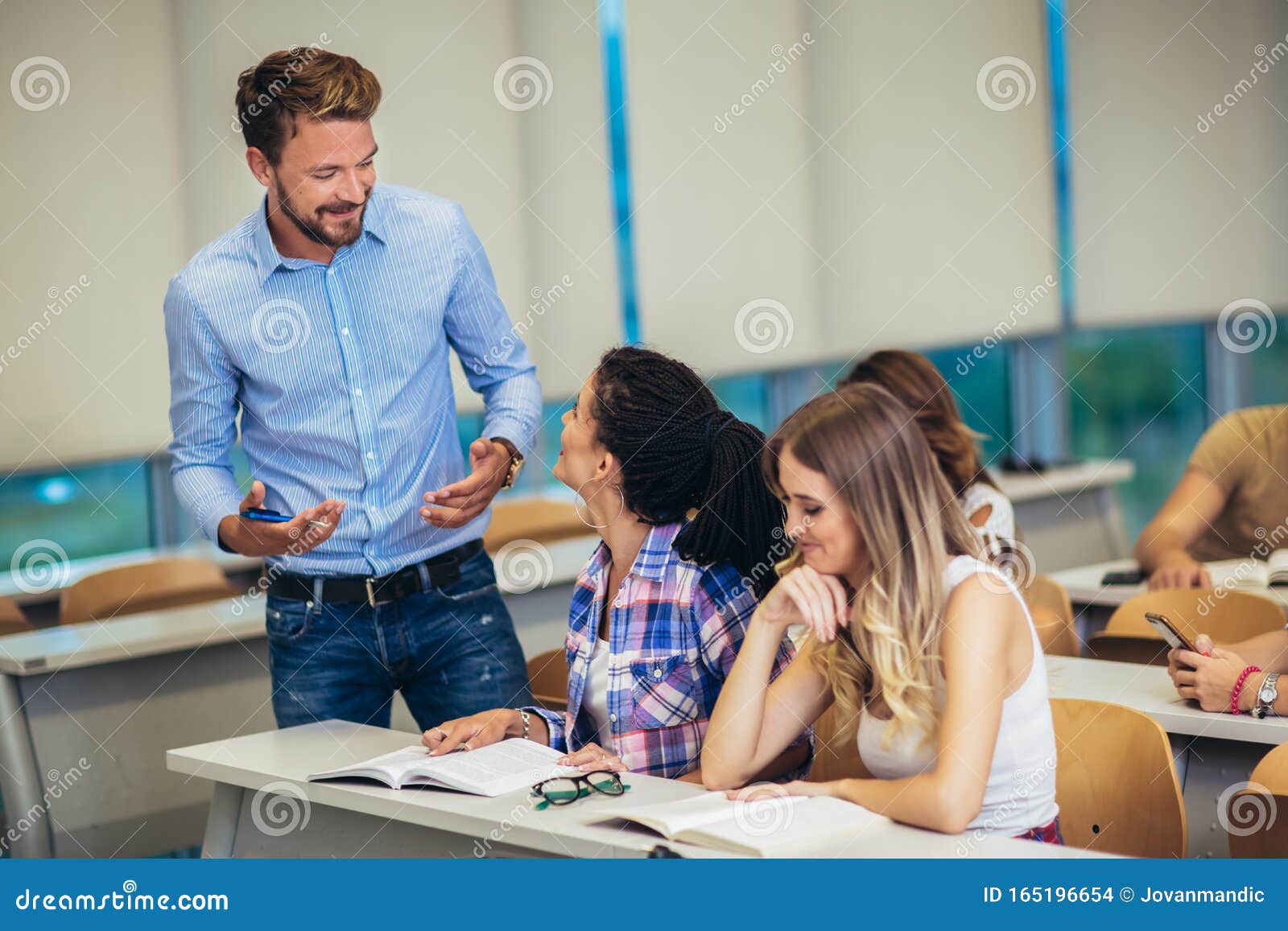 Tutor Teaching University Students in Classroom Stock Photo - Image of ...