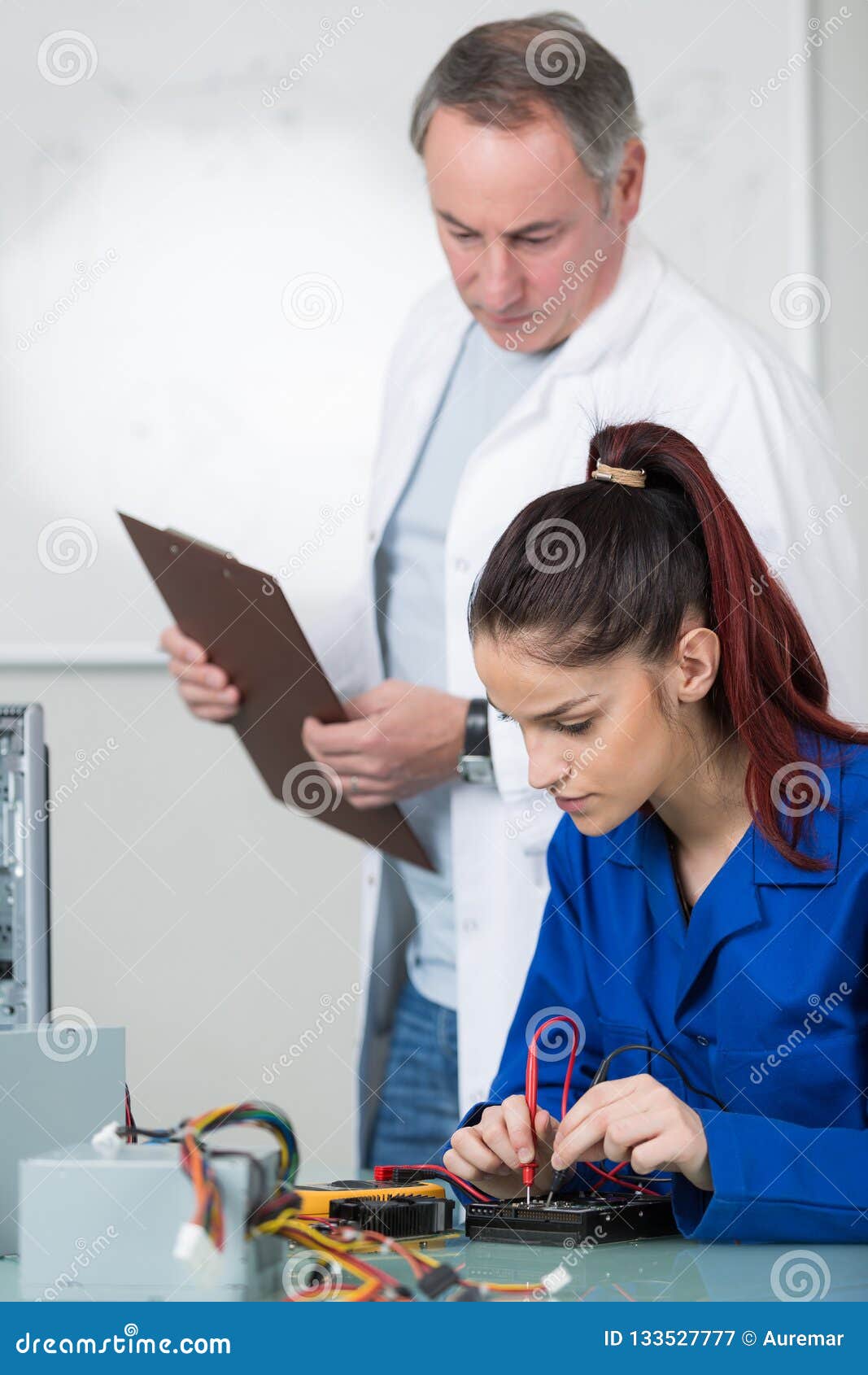 Tutor and Young Student Setting Up Computer Stock Image - Image of ...