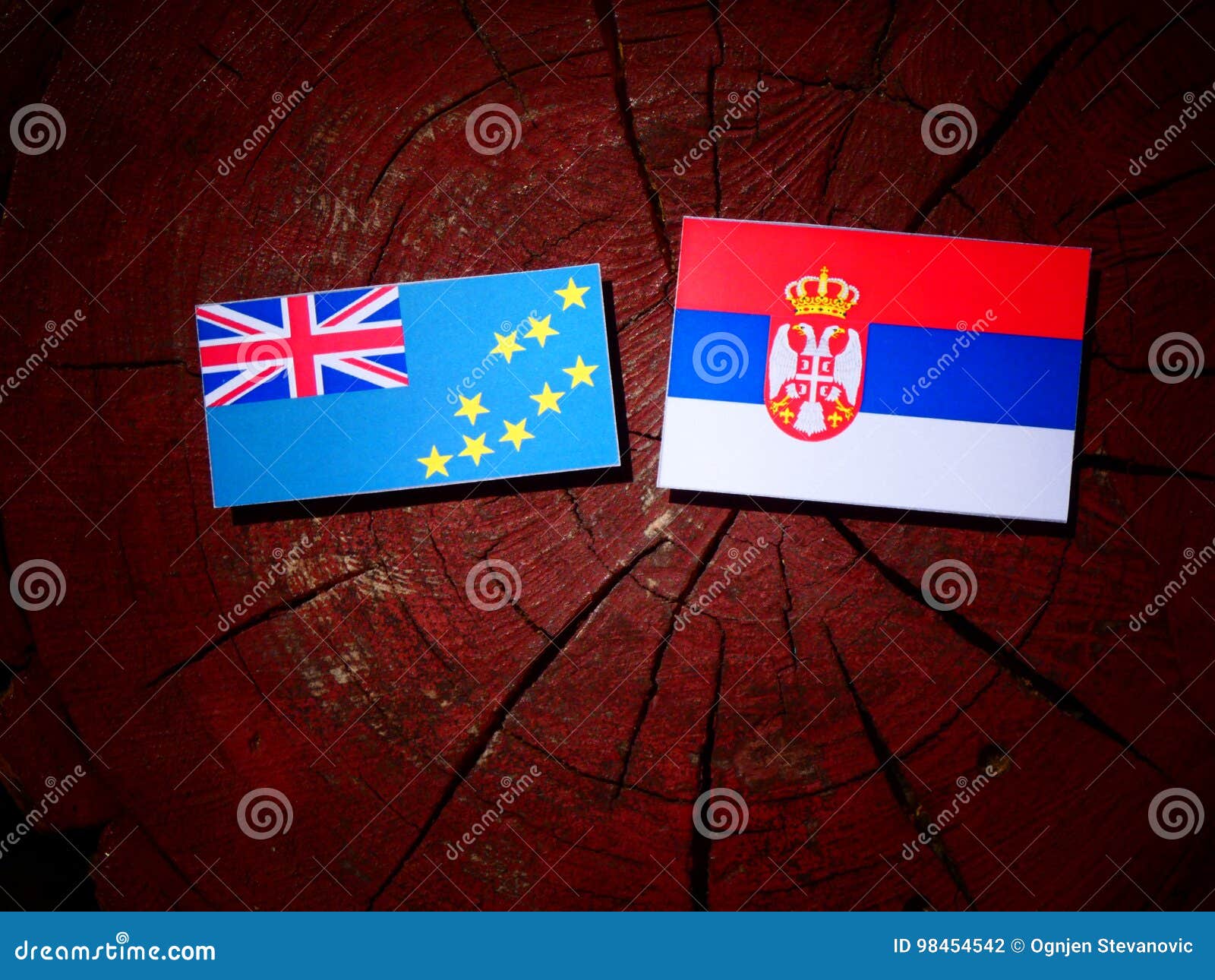Tuvalu Flag with Serbian Flag on a Tree Stump Isolated Stock Photo ...