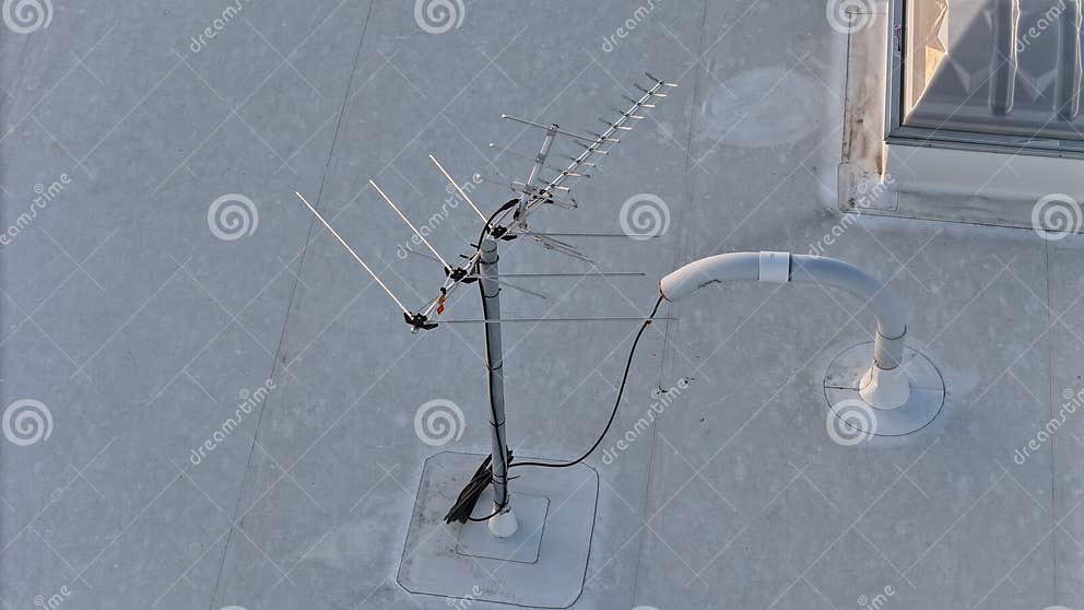 TV Antenna Rooftop Install with Cable Going into PVC Pipe Stock Photo ...