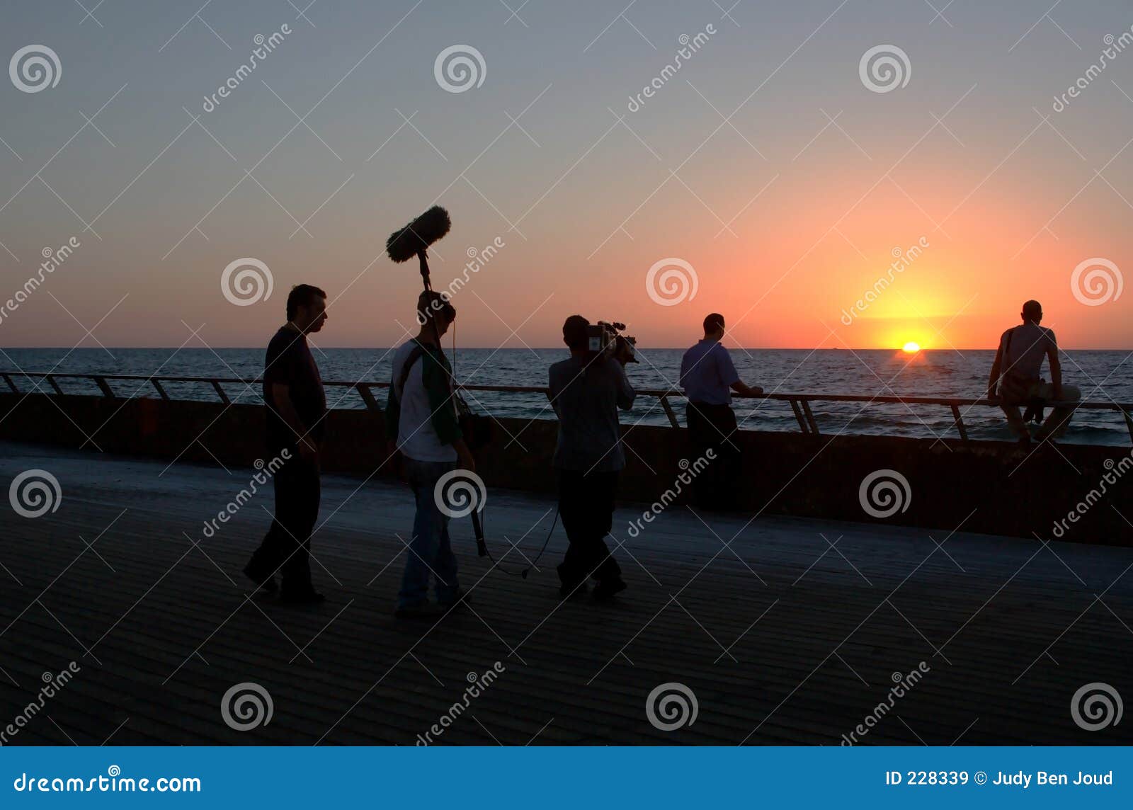 TV crew at sunset stock image. Image of crew, silouettes - 228339