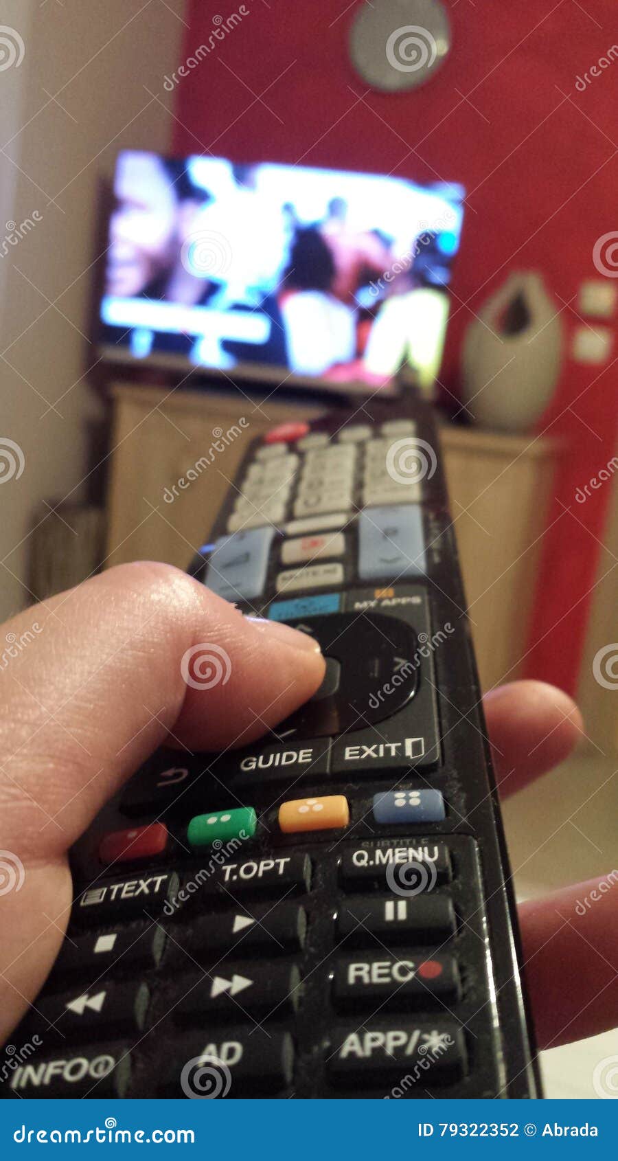 TV remote control in hand stock photo. Image of relaxation - 79322352