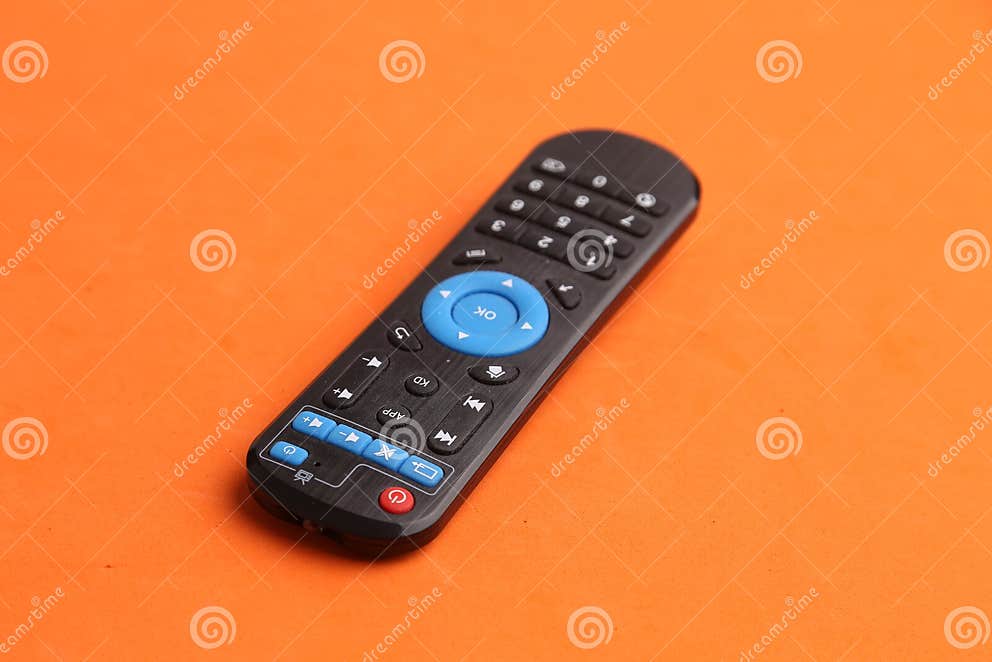 TV Remote Control on an Orange Background Stock Image - Image of view ...
