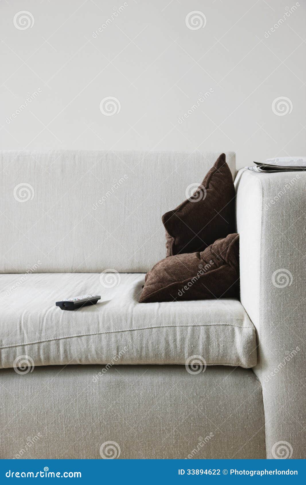 TV Remote Control on Sofa stock photo. Image of control - 33894622