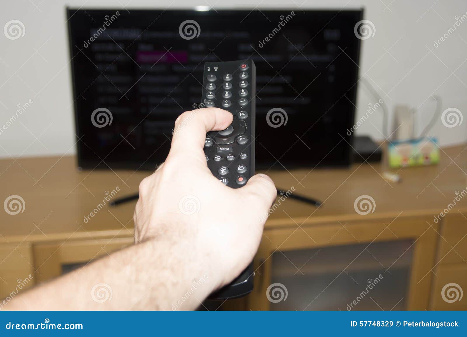 TV and remote controller stock image. Image of home, leisure - 57748329