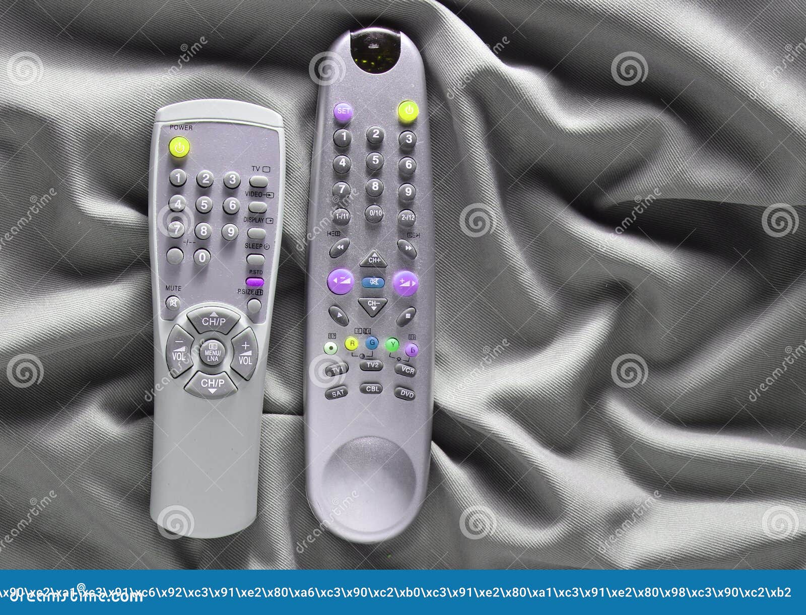 TV Remote Controls on a Gray Silk Background. Stock Photo - Image of ...