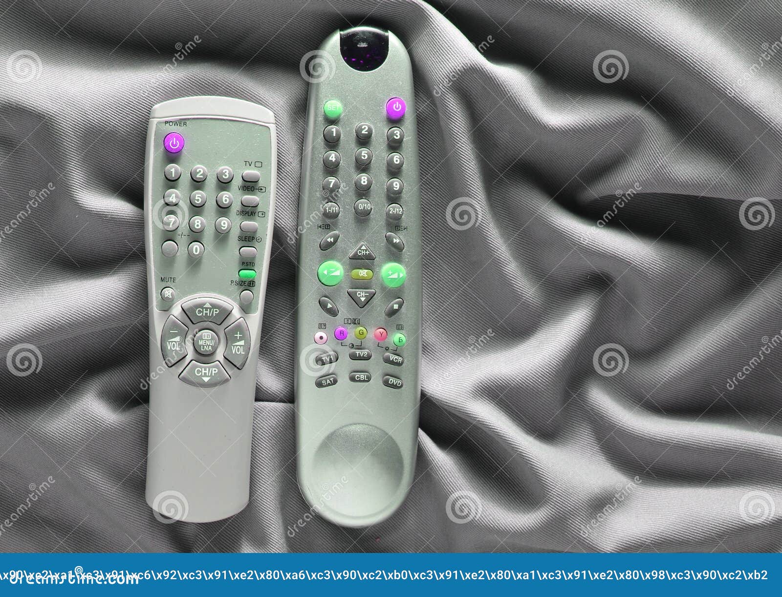 TV Remote Controls on a Gray Silk Background. Stock Photo - Image of ...
