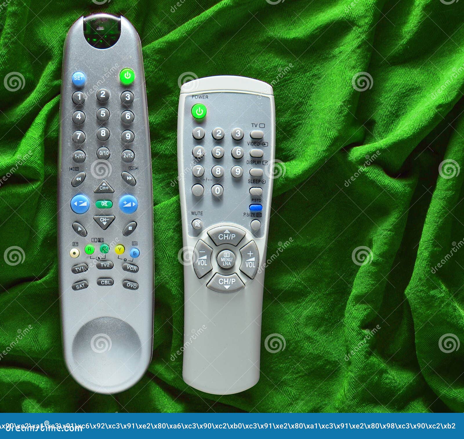 TV Remote Controls on Green Silk Background Stock Image - Image of ...