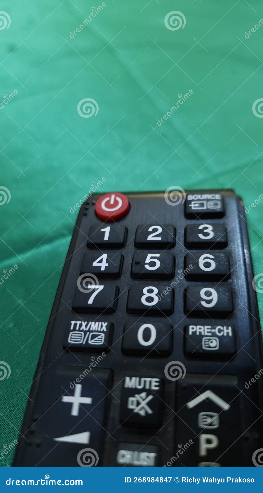 TV remote on a green table stock image. Image of device - 268984847