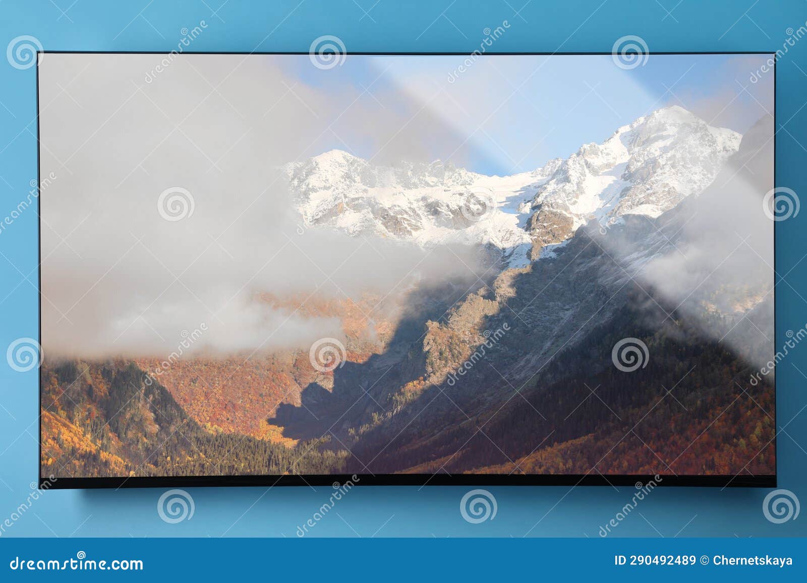 TV Screen with Mountain Landscape on Light Blue Wall Stock Image ...