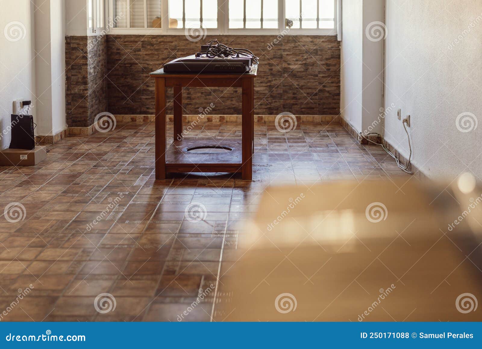 TV Set Lying on a Table in an Empty Living Room Stock Photo - Image of ...