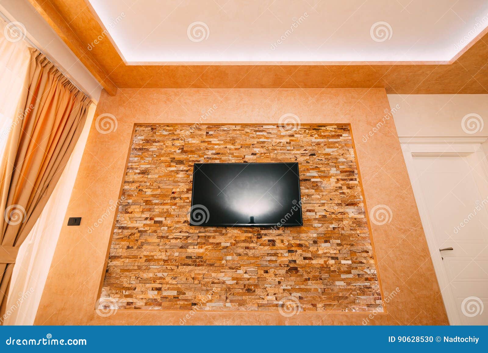 TV on the Wall. TV Hanging on the Wall Stock Photo - Image of media ...