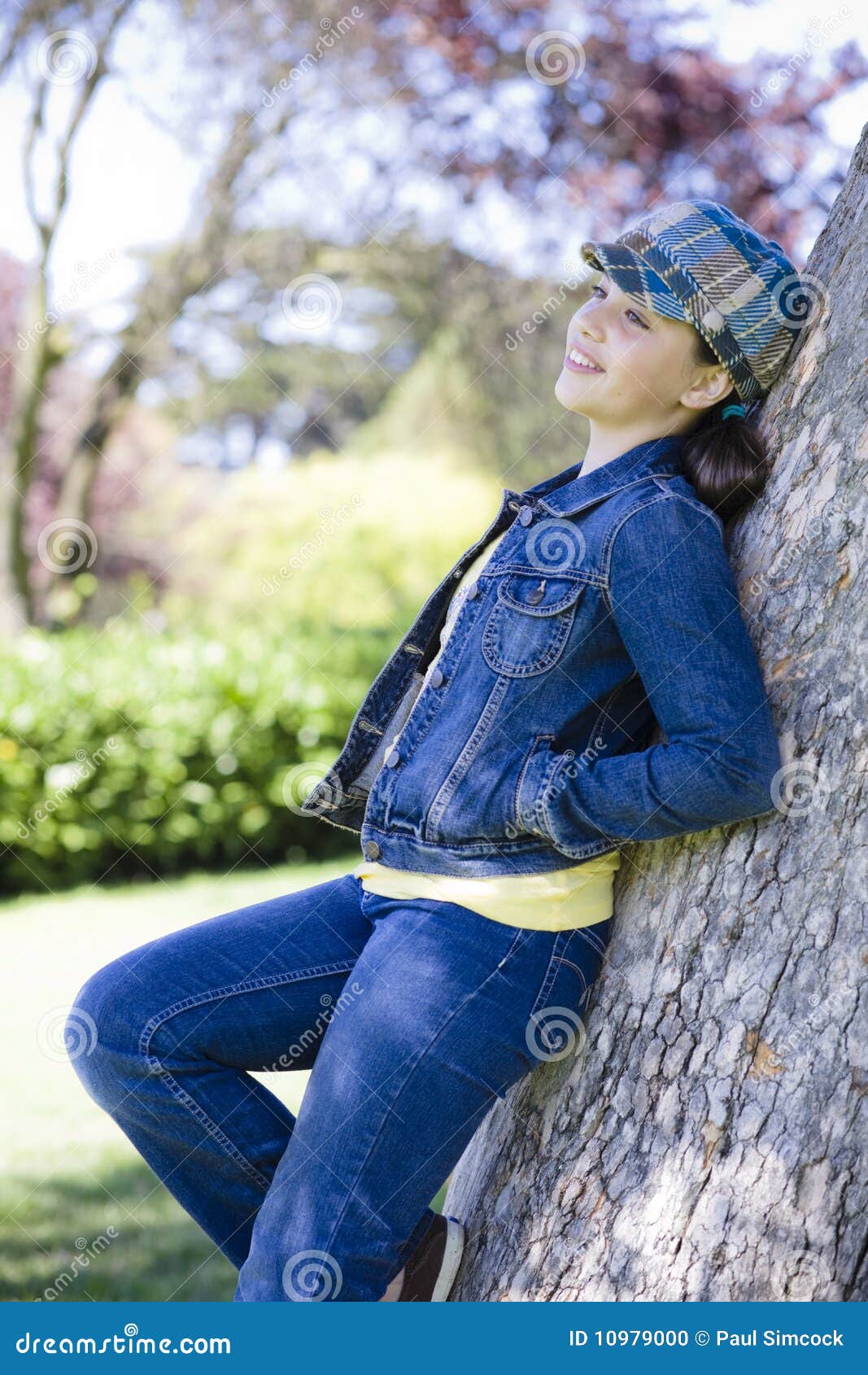 Tween Girl leaning on Tree stock photo. Image of nature - 10979000