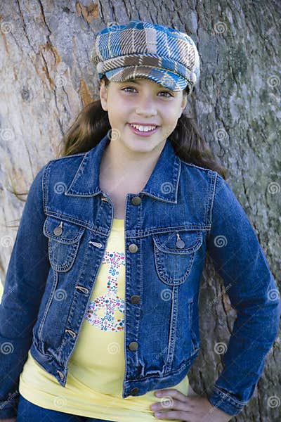 Tween Girl leaning on Tree stock image. Image of outdoors - 10979011