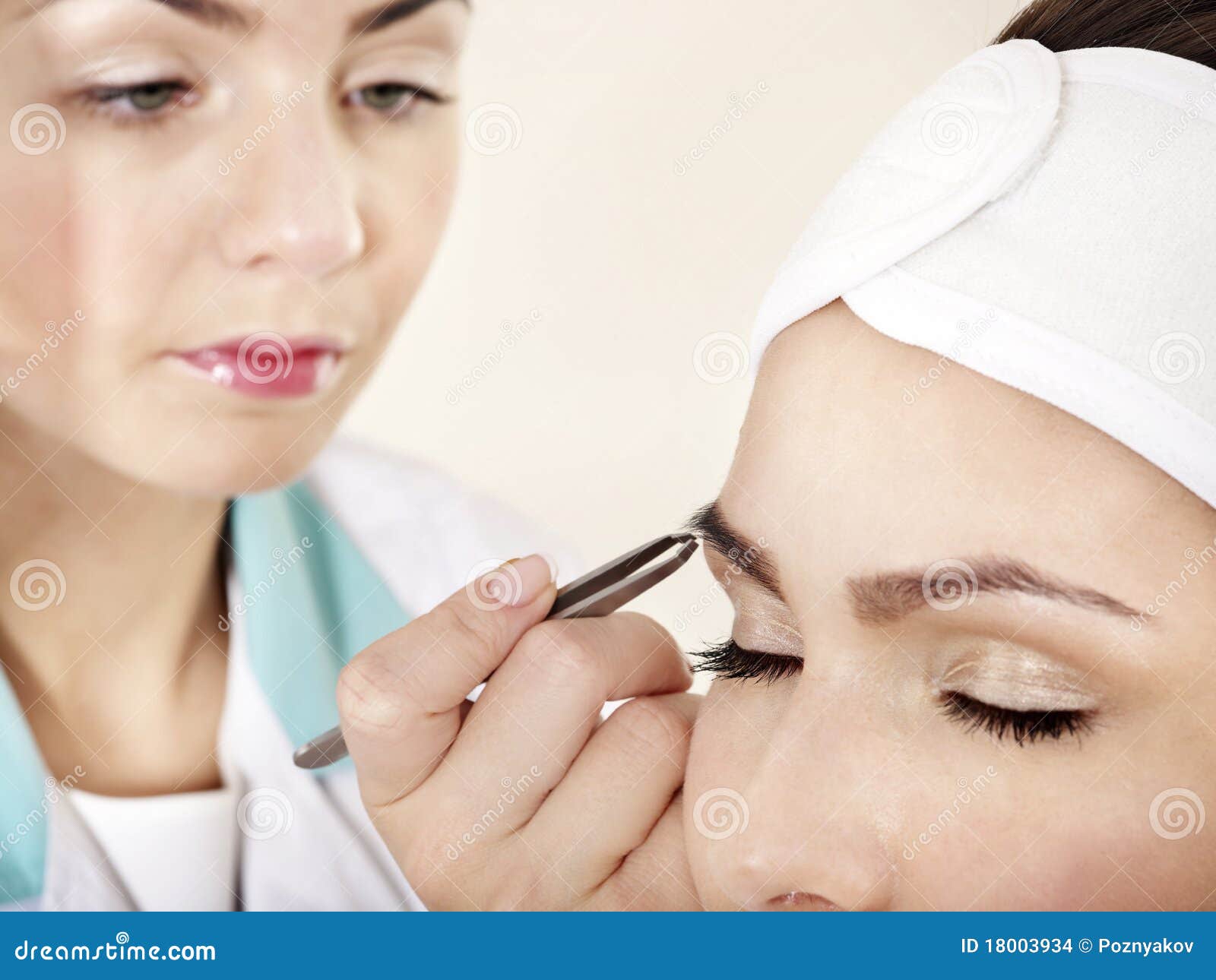 Tweezing Eyebrow by Beautician. Stock Photo - Image of beauty ...