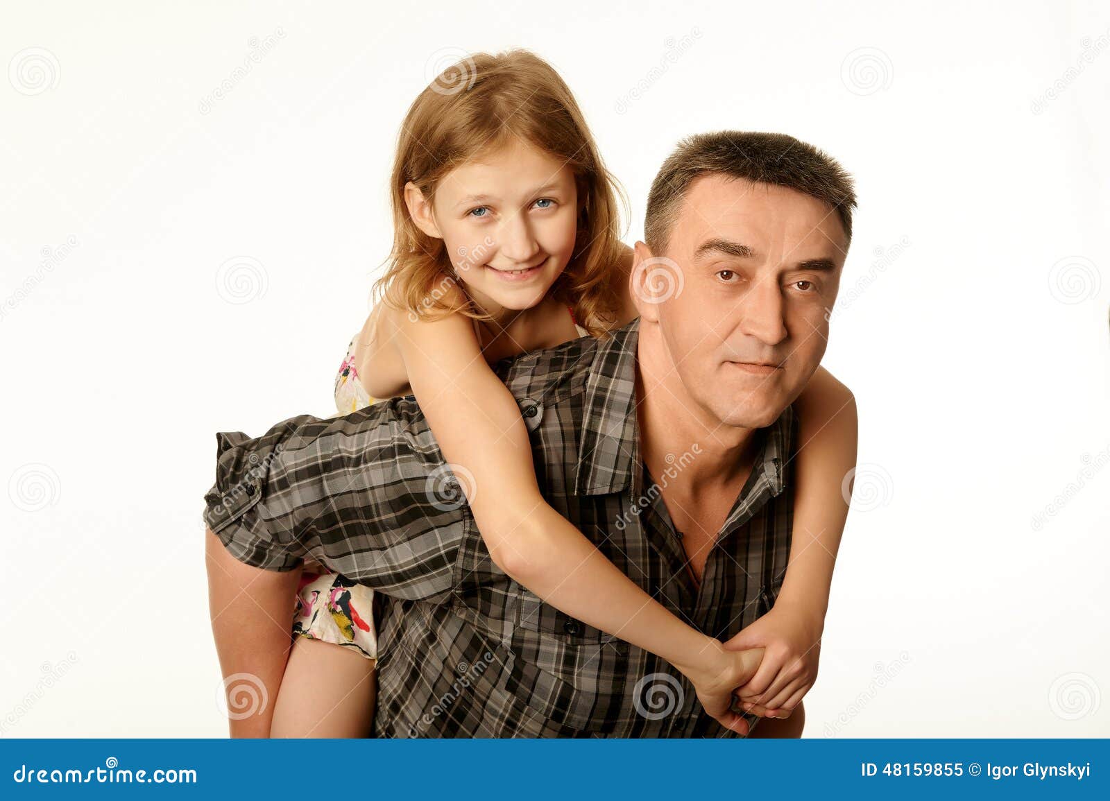 Twelve Year Old Daughter Hugging Her Father Sitting On His Back Stock