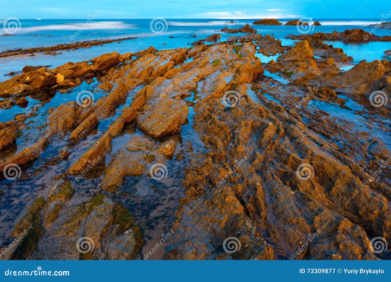 Twilight Ocean Coast with Ribbed Stratiform Rock. Stock Image - Image ...