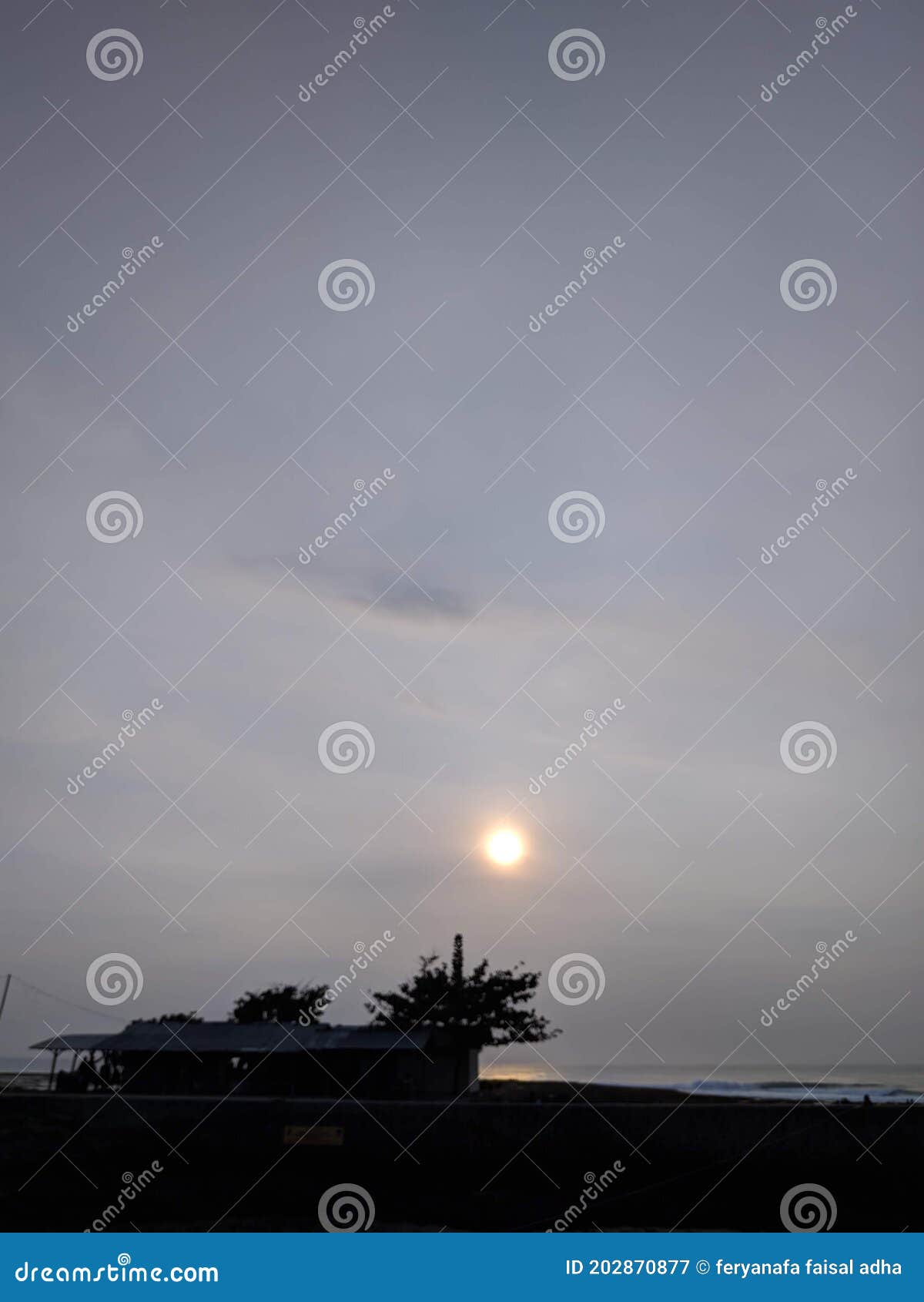 The Twilight Sun As the Sun Sets Over a Very Beautiful Tree Stock Image ...