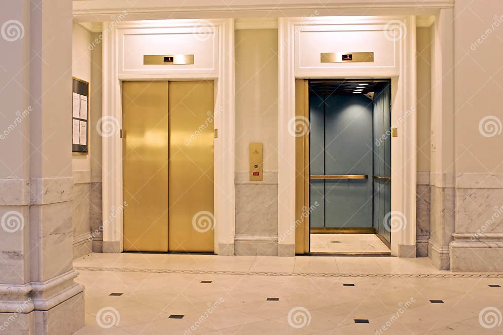 Twin elevators stock photo. Image of lobby, brass, structure - 7810330