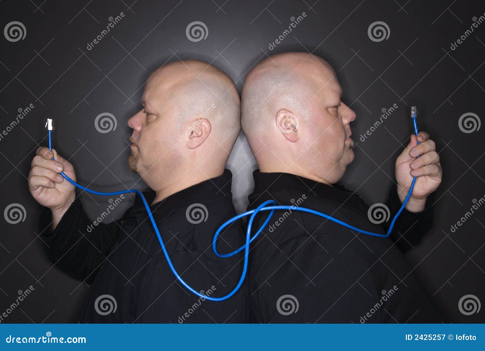 Twin men holding cable. stock image. Image of people, kinship - 2425257