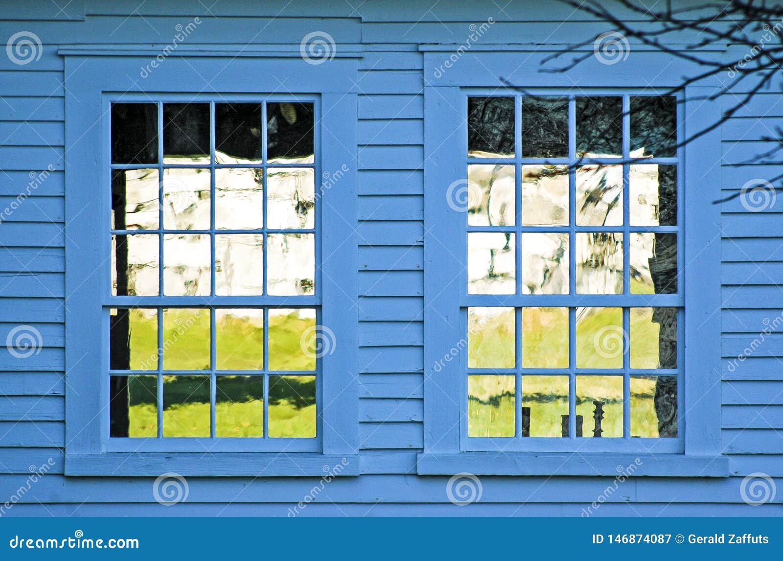Twin Windows on Blue Building Stock Image - Image of tree, blue: 146874087