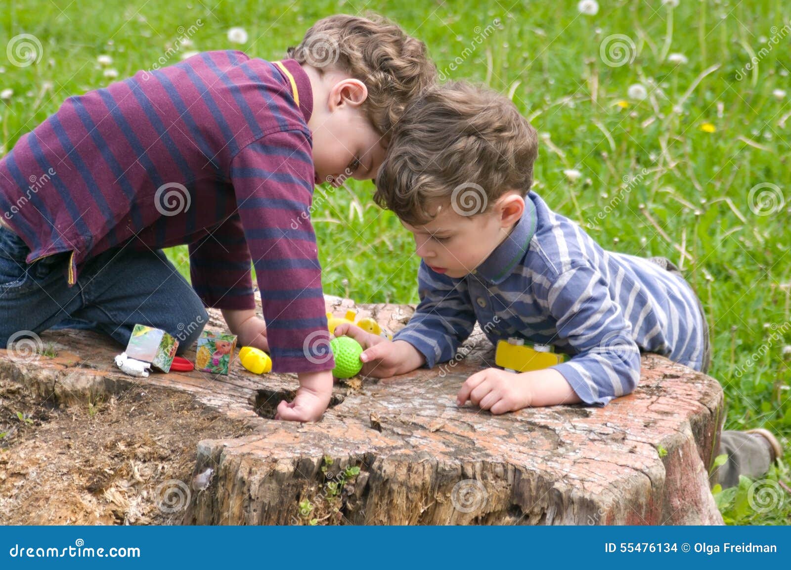 Twins Play with Concentration Stock Photo - Image of shirts, game: 55476134