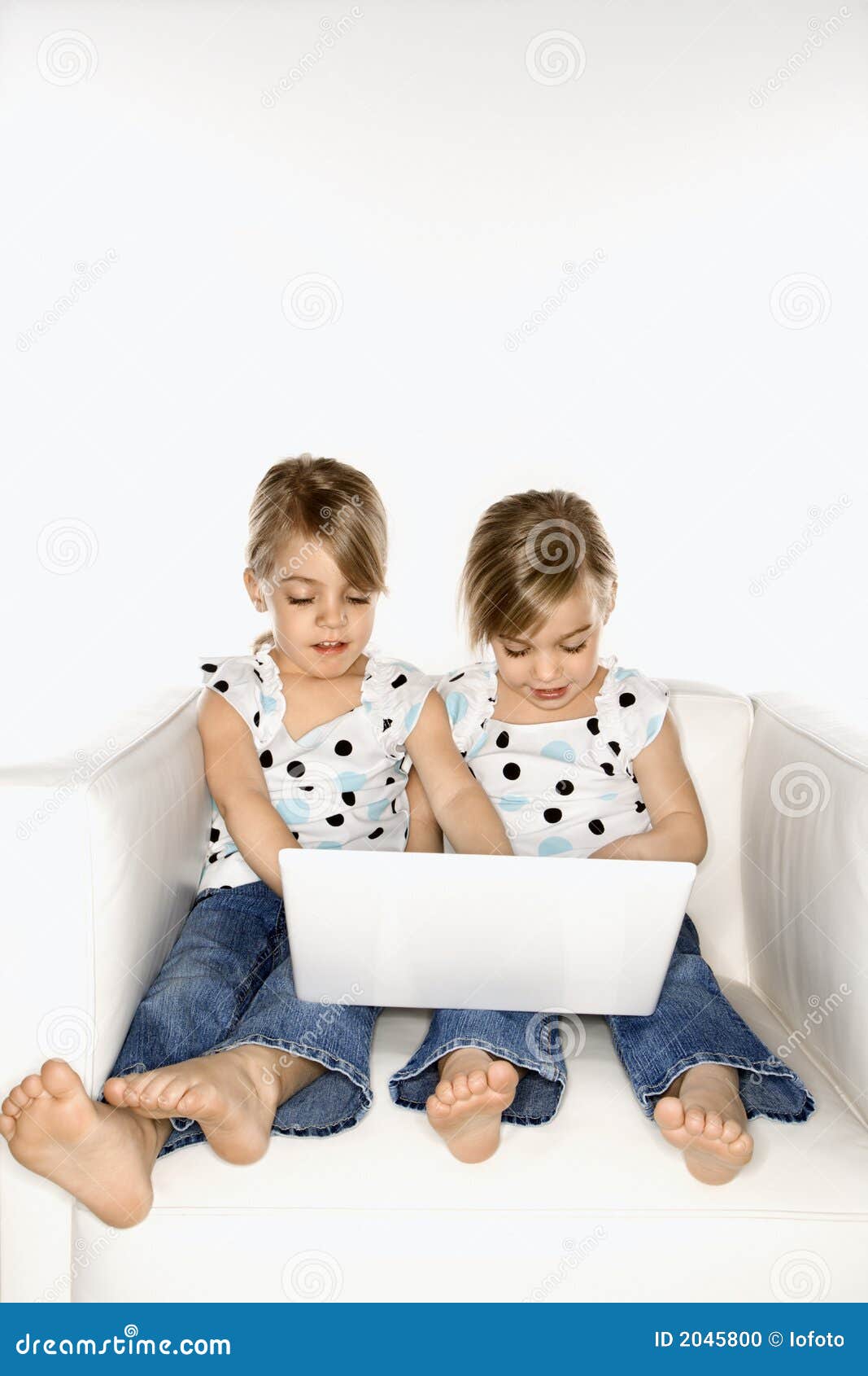 Twins playing on computer. stock photo. Image of twin - 2045800