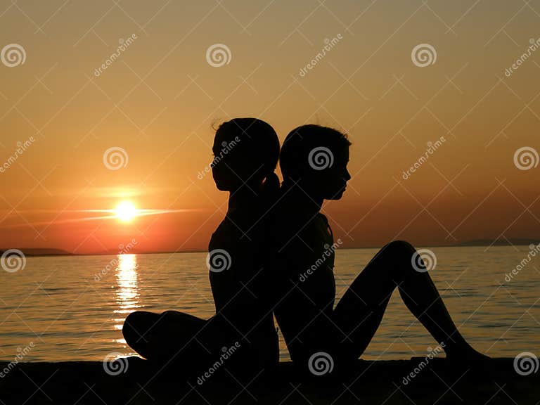 Twins Sisters Resting in the Sunset Stock Photo - Image of girls ...