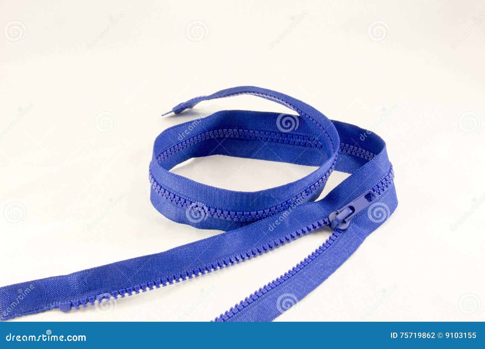 Twisted Blue Zipper on a Light Cloth Stock Photo - Image of cloth ...