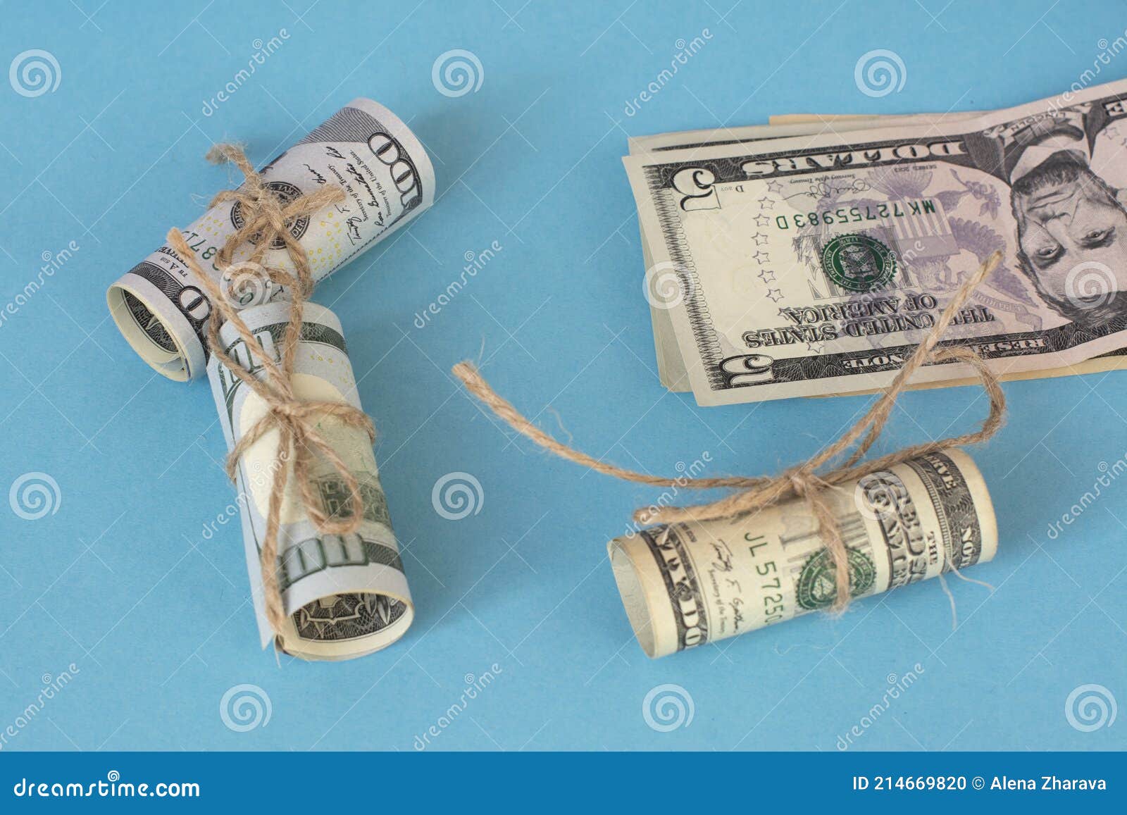 Twisted Bundle 100 Dollar Bills on a Blue Background Stock Photo ...