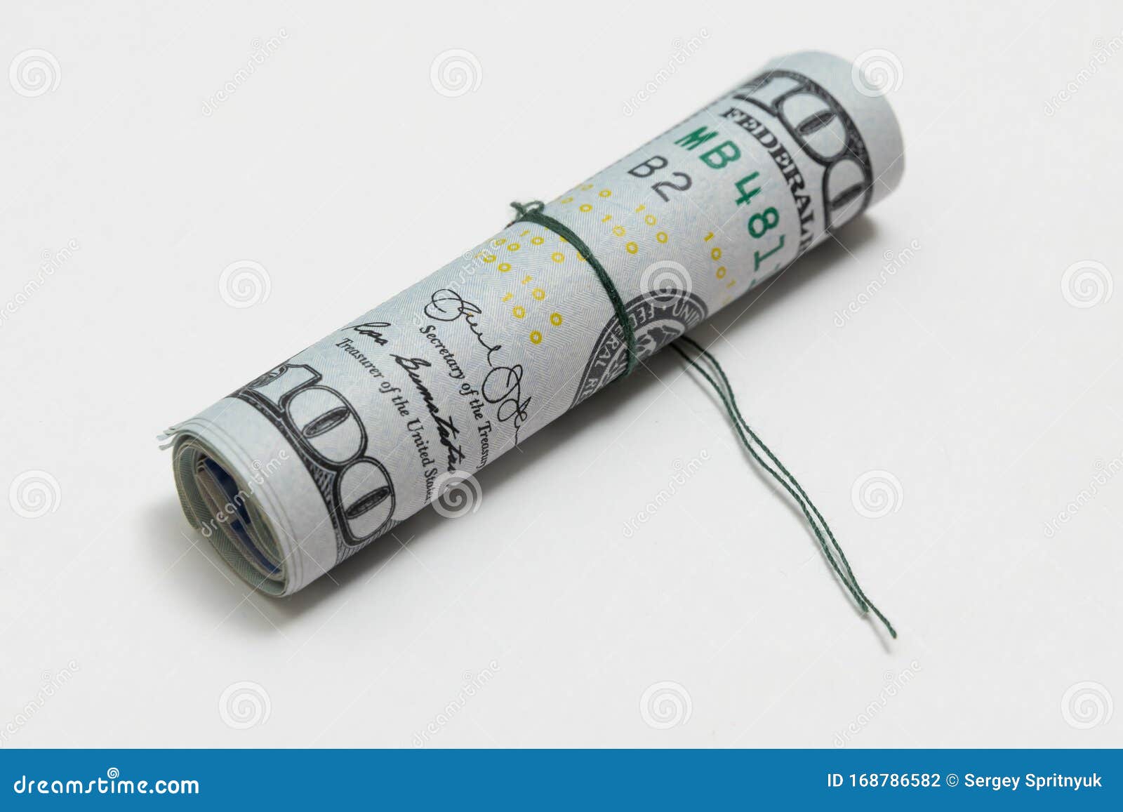 Twisted Bundle 100 Dollar Bills On A Yellow Background Stock ...