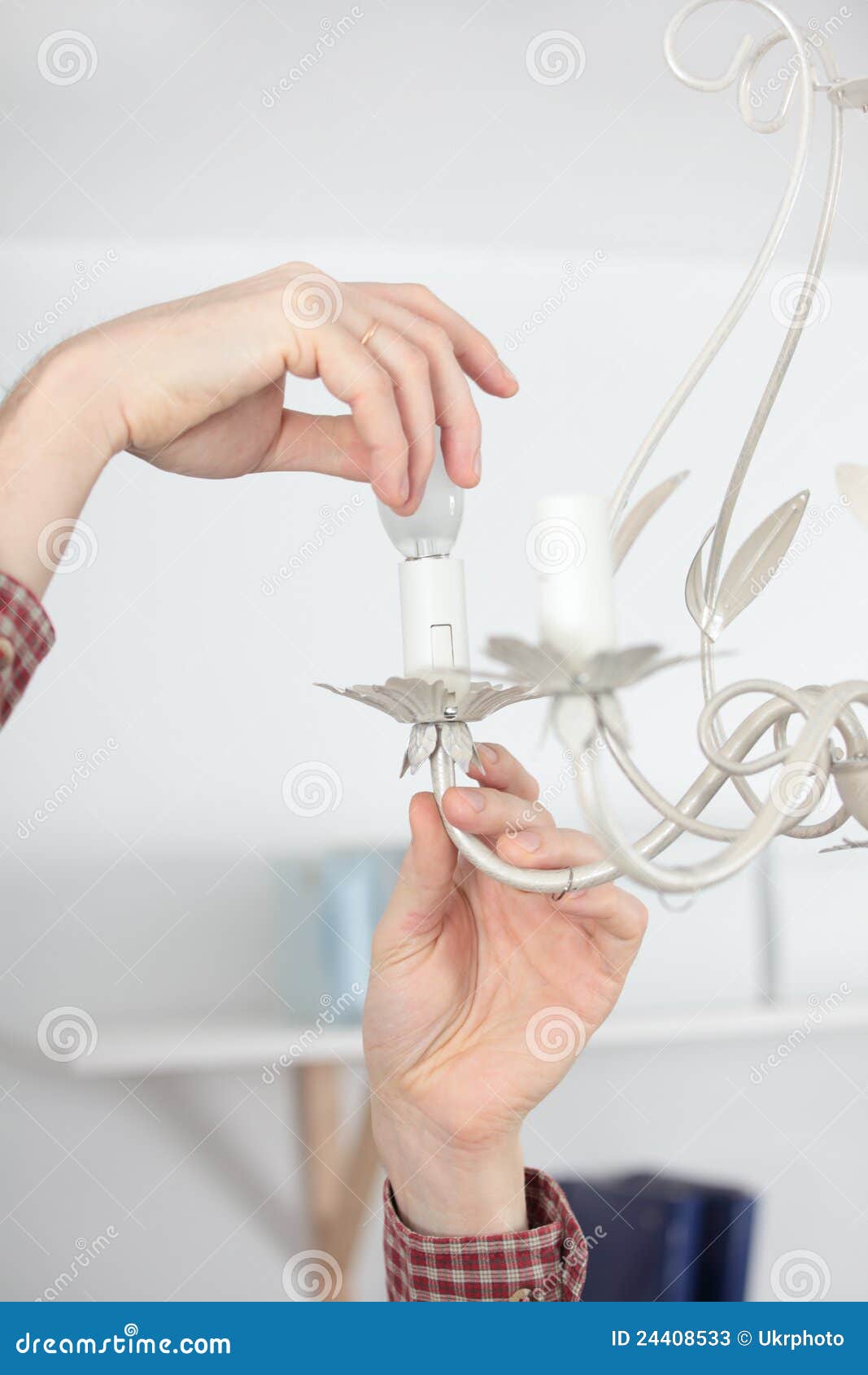 Twisting a light bulb stock image. Image of vertical - 24408533