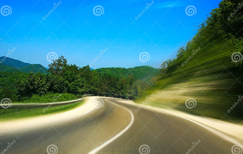 Twisting road to mountains stock image. Image of side - 27991763