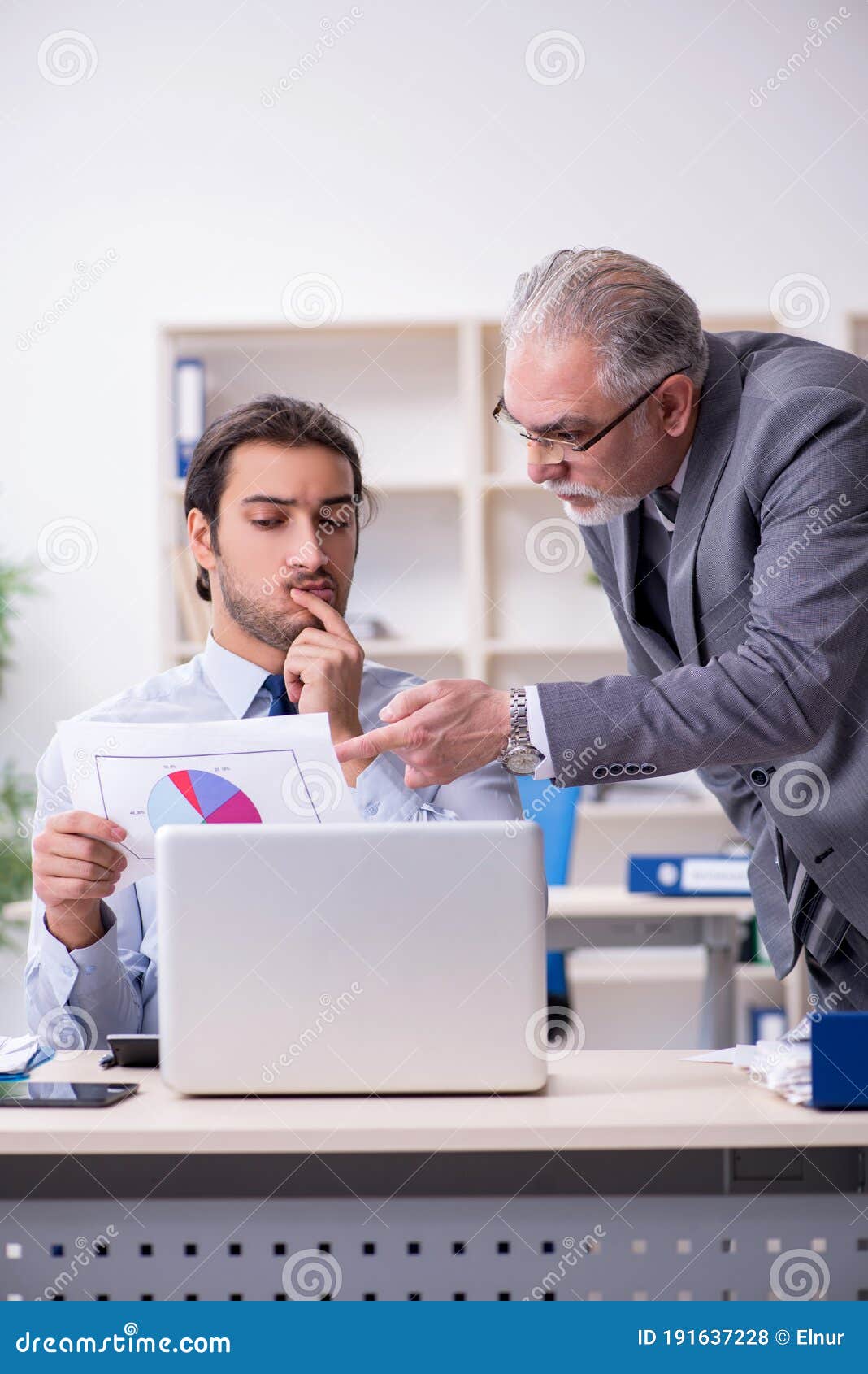 Two Accountants Working in the Office Stock Photo - Image of paper ...