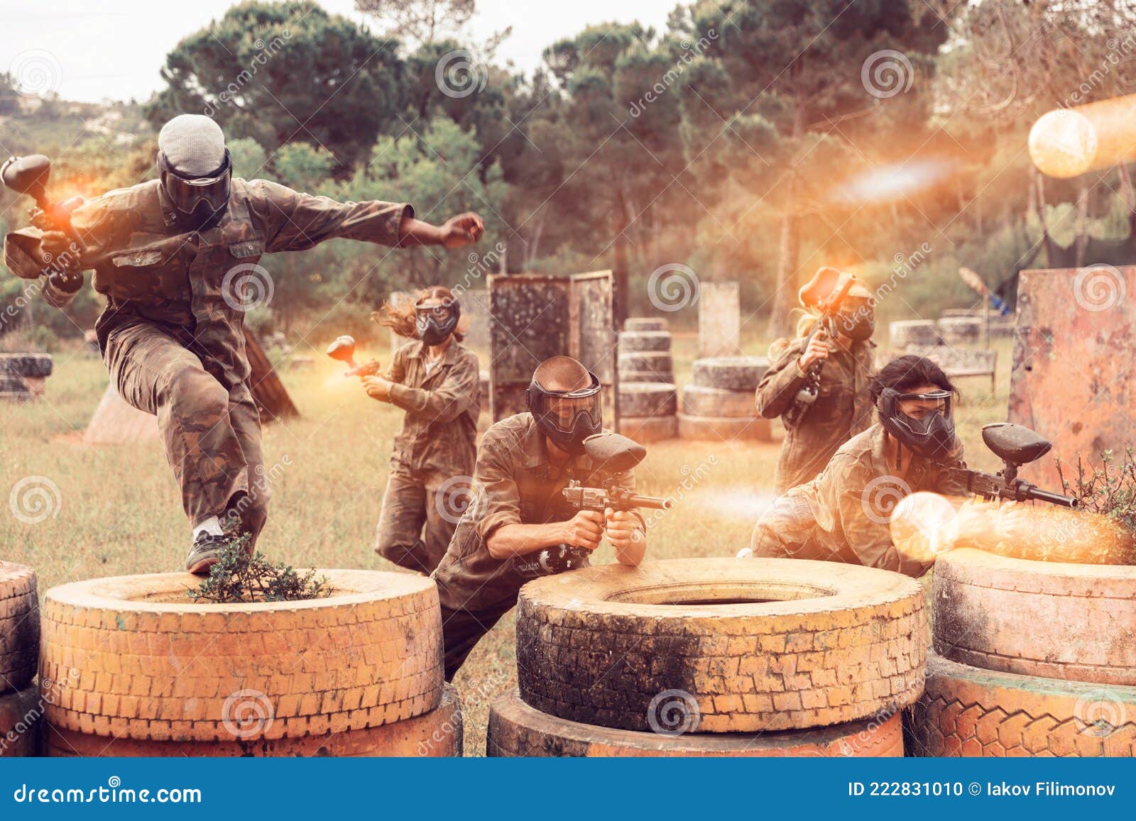 Two Active Opposing Teams with Guns Playing Paintball Stock Photo ... Two Active Opposing Teams with Guns Playing Paintball Stock Photo ...
