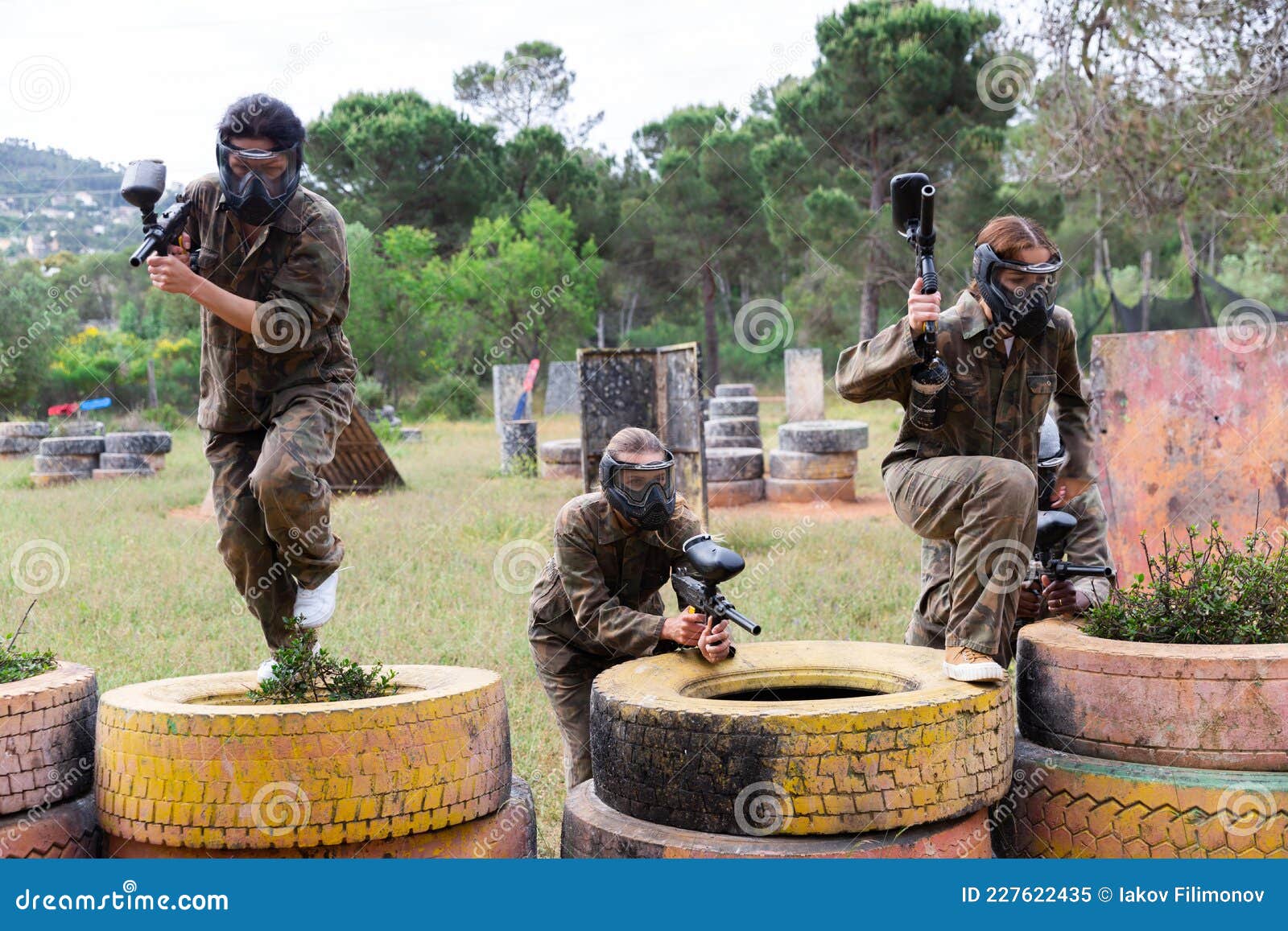 Two Active Opposing Teams with Guns Playing Paintball Stock Image ... Two Active Opposing Teams with Guns Playing Paintball Stock Image ...