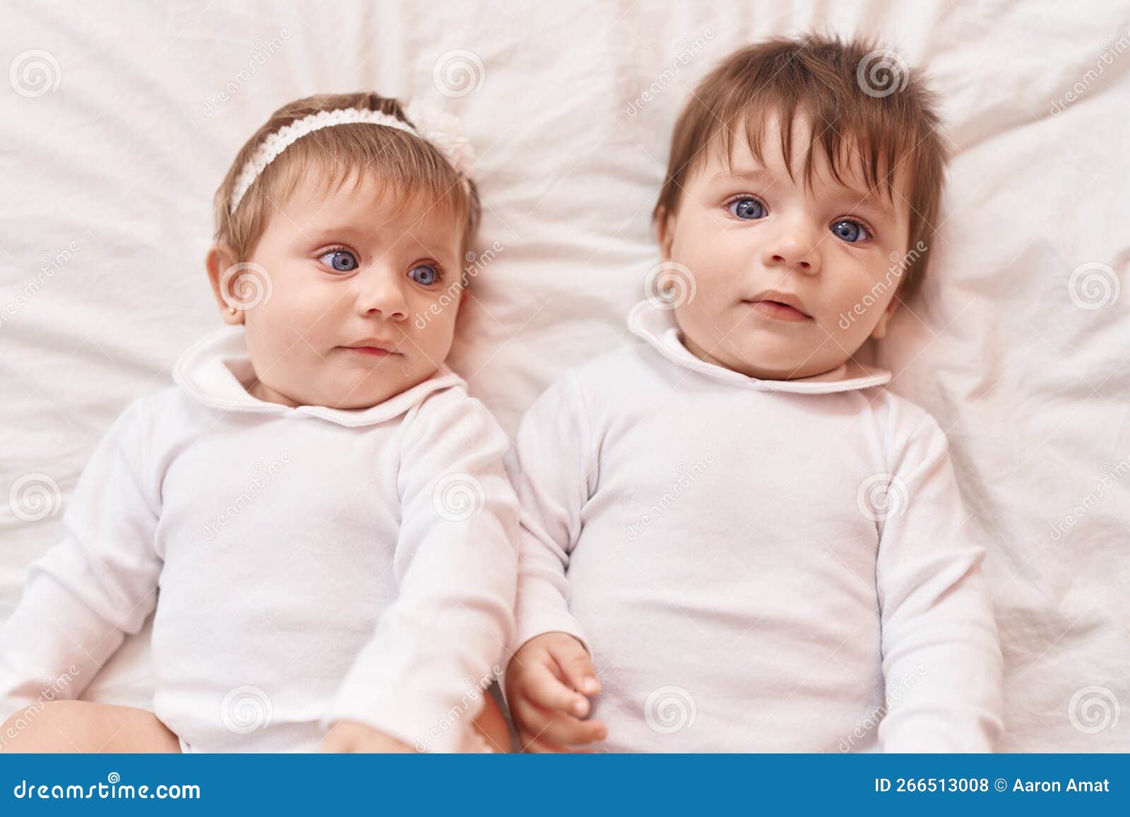Two Adorable Babies Lying on Bed at Bedroom Stock Photo - Image of ...