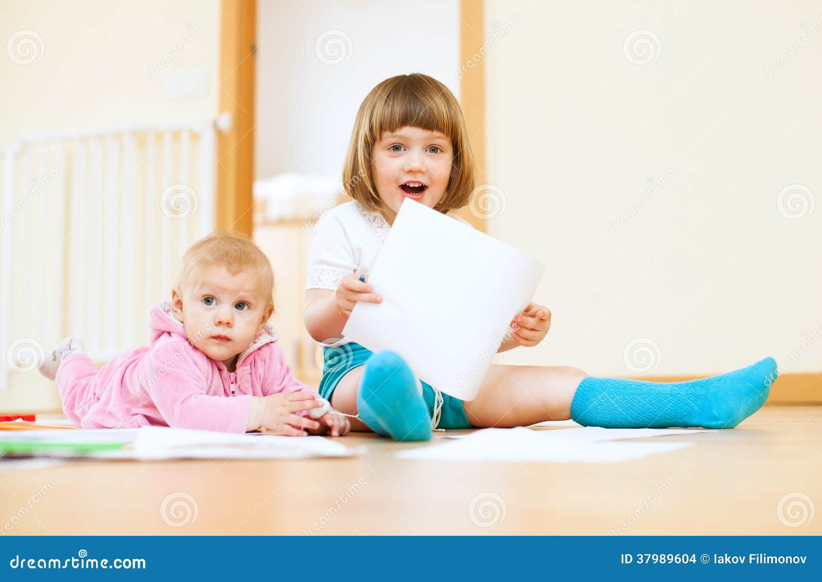 Two Adorable Siblings with Paper Stock Photo - Image of satisfied ...
