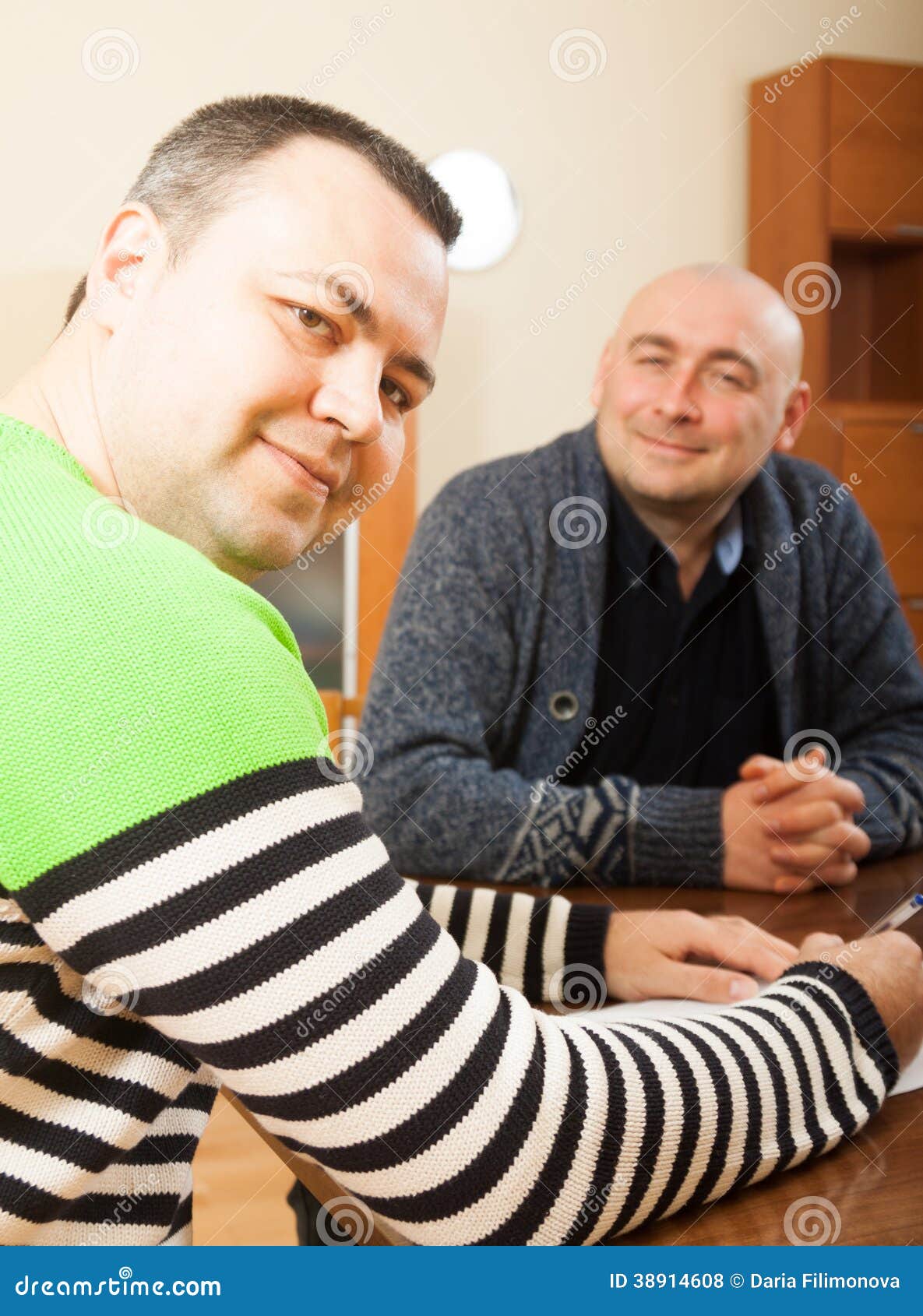 Two adult men discussing stock photo. Image of group - 38914608
