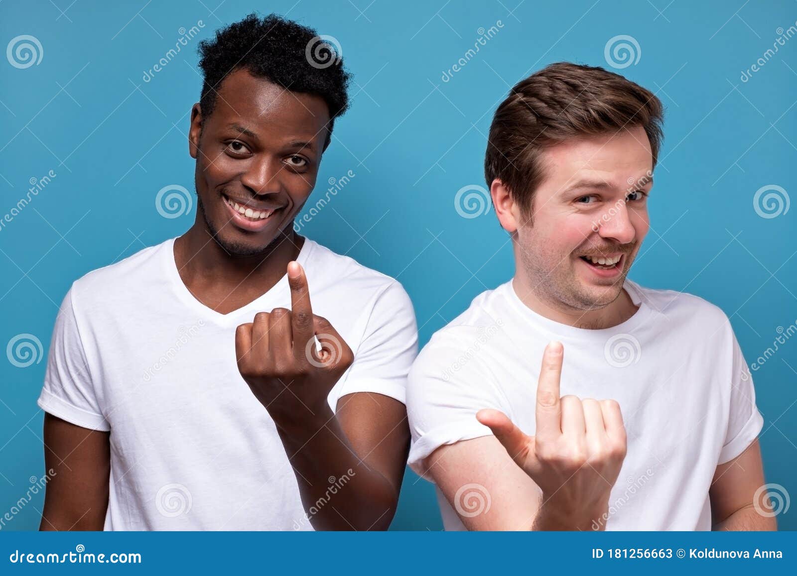 Two Adult Showing Come Here Gesture with Index Finger and Smiling Over ... Two Adult Showing Come Here Gesture with Index Finger and Smiling Over ...