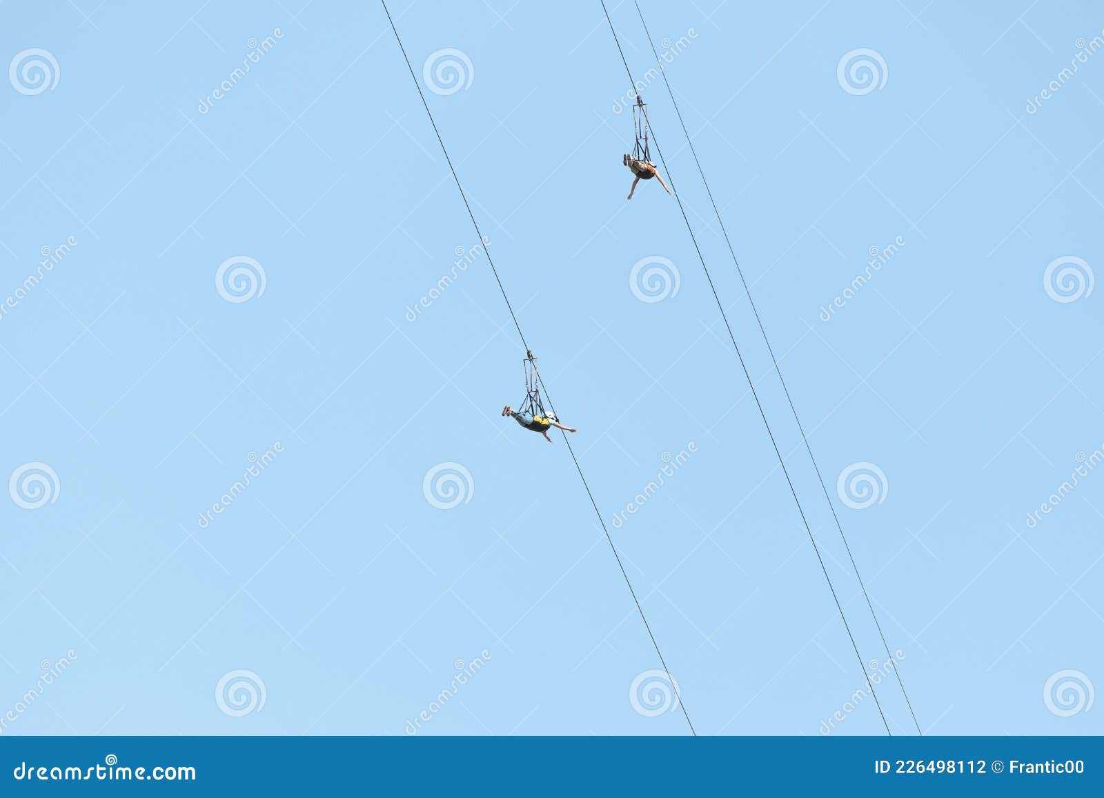 Adventurers Fly Down a Zip Line Rope in an Extreme Rope Park Stock ...