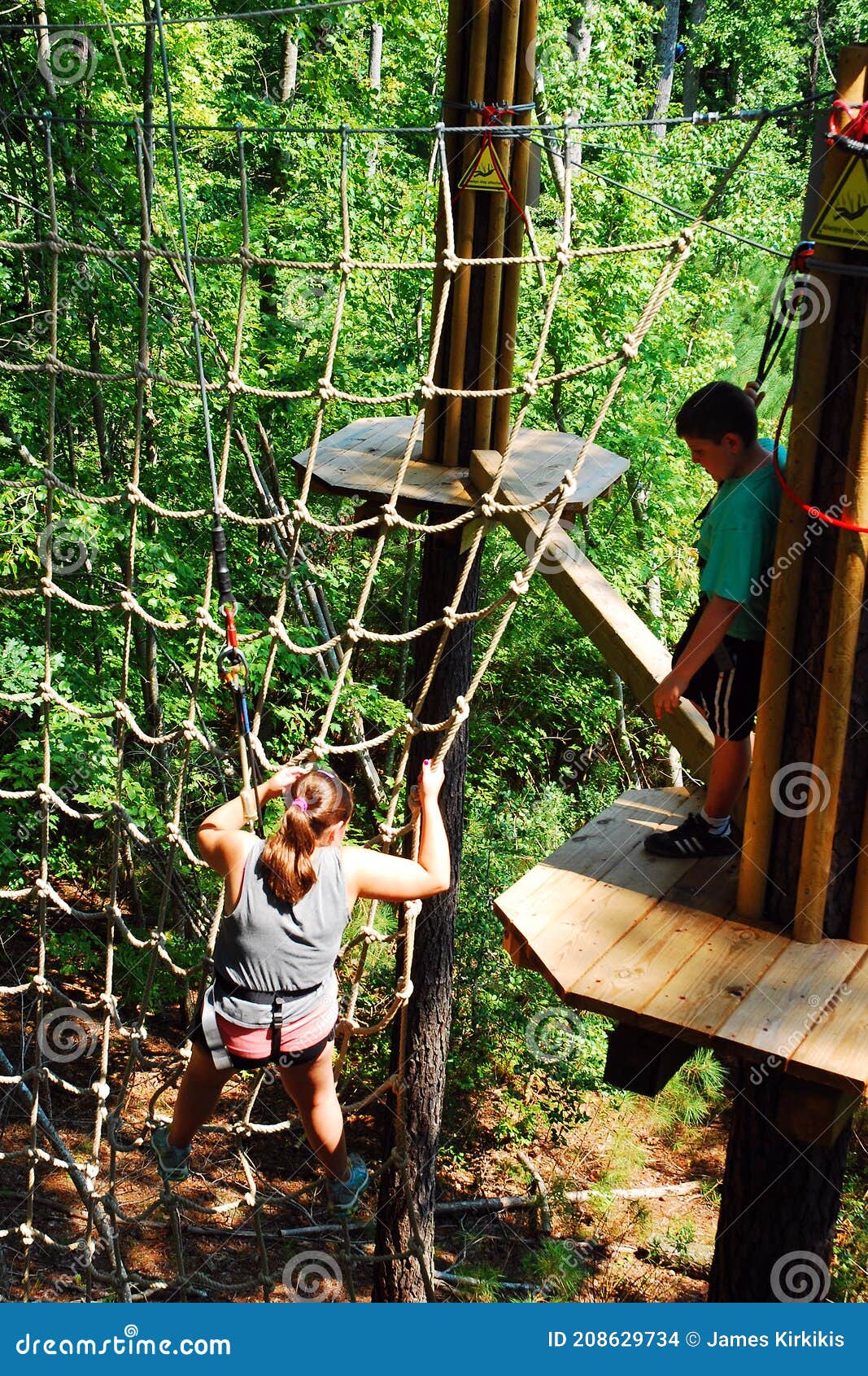Two Adventurers Walk Across a Rope Web Stock Photo - Image of american ...