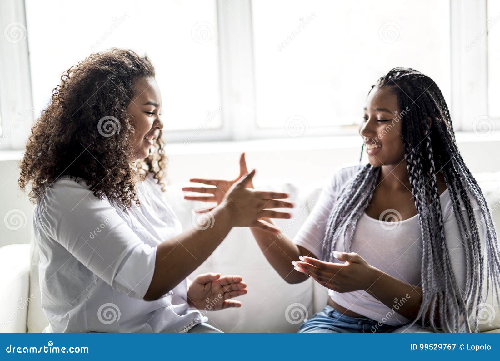 Affectionate Friends Afro American Sitting on Sofa Stock Image - Image ...