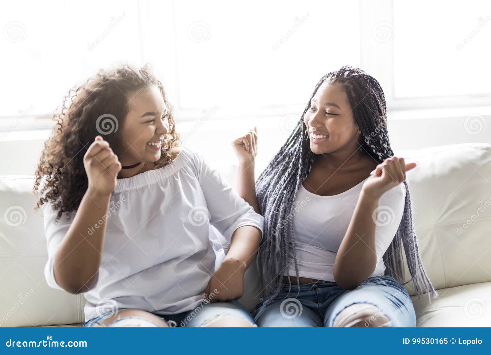 Affectionate Friends Afro American Sitting on Sofa Stock Image - Image ...