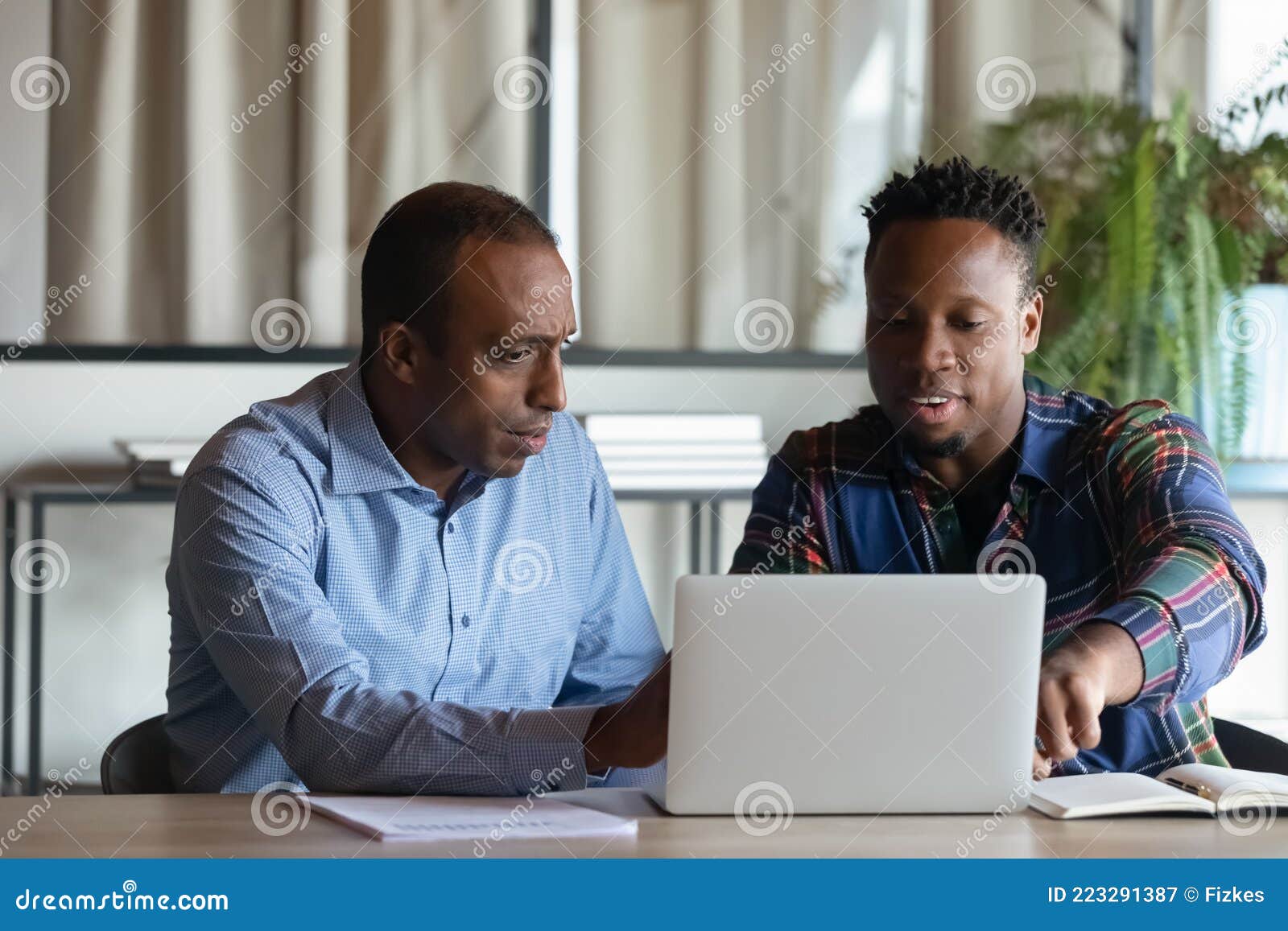Two African American Employees Working on Project Together, Using ...