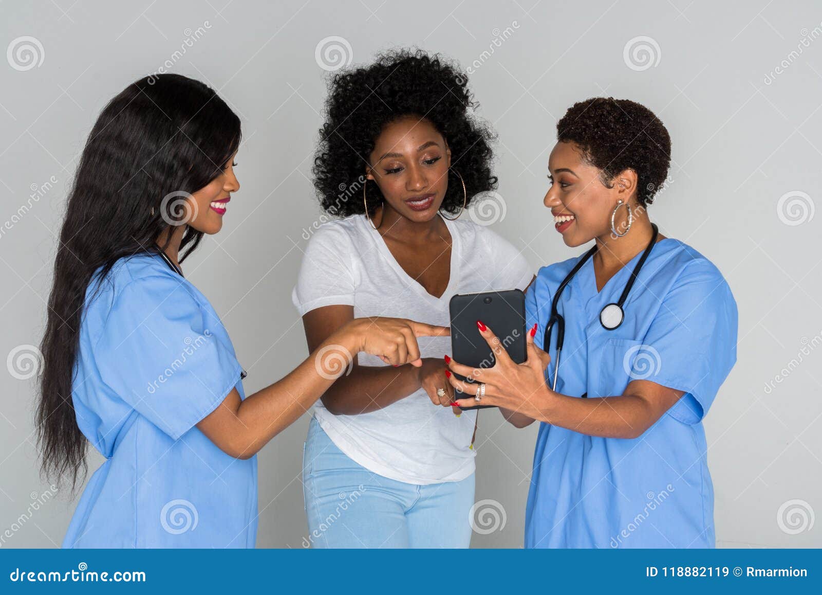 Two Nurses with Patient stock image. Image of patient - 118882119
