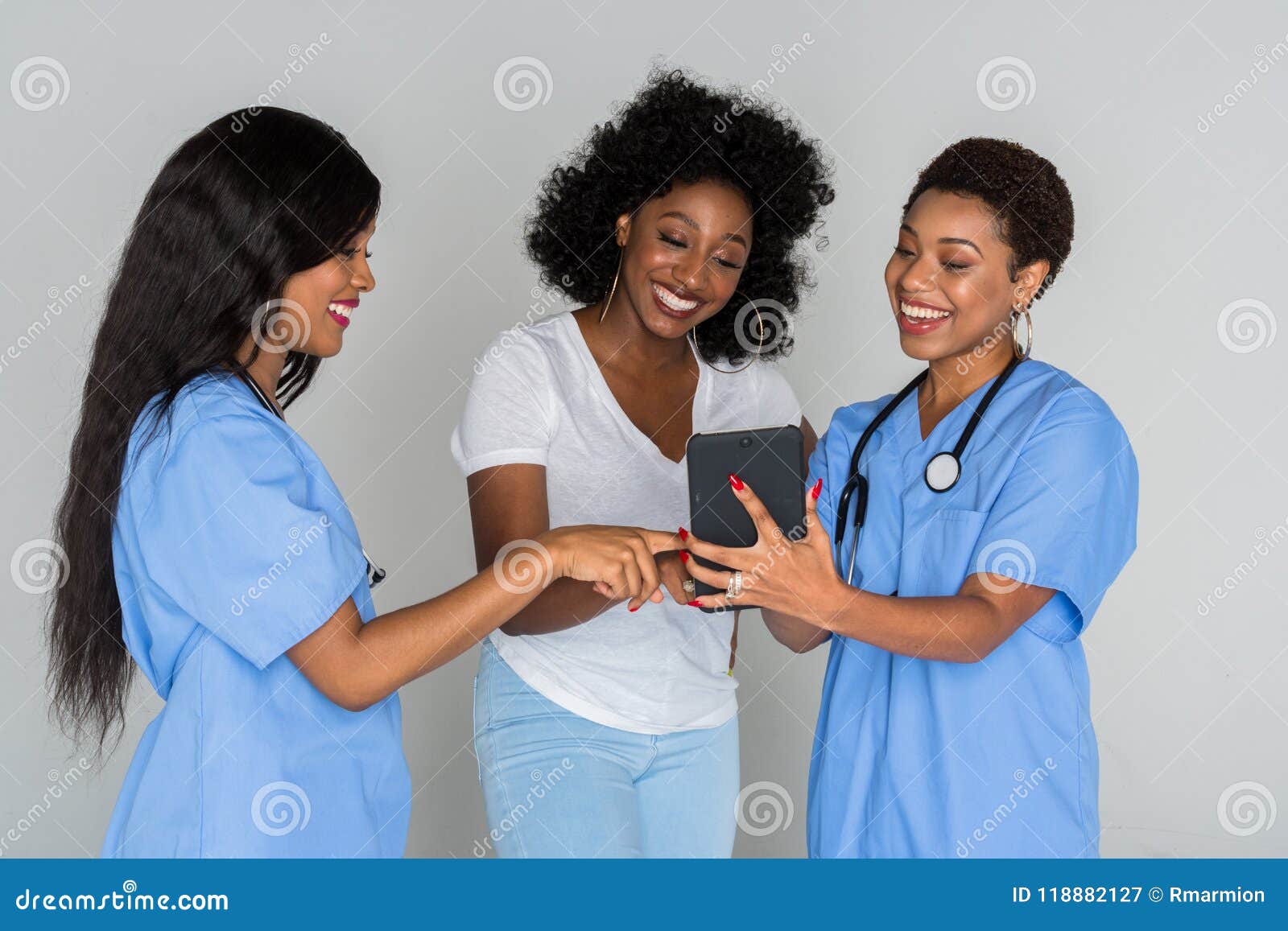 Two Nurses with Patient stock image. Image of minority - 118882127