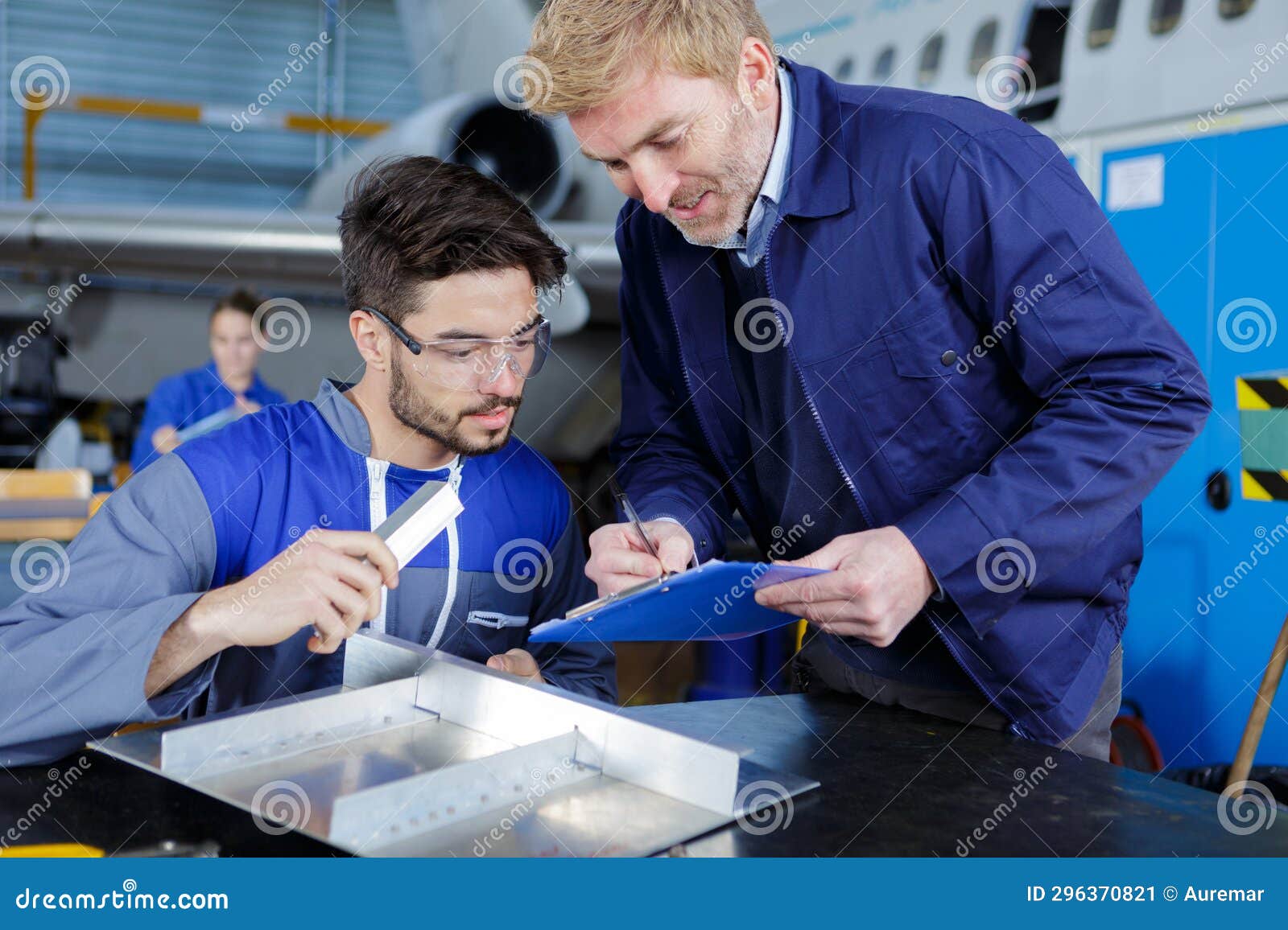 Two Aircraft Assembling Mechanics Stock Image - Image of team, aviation ...
